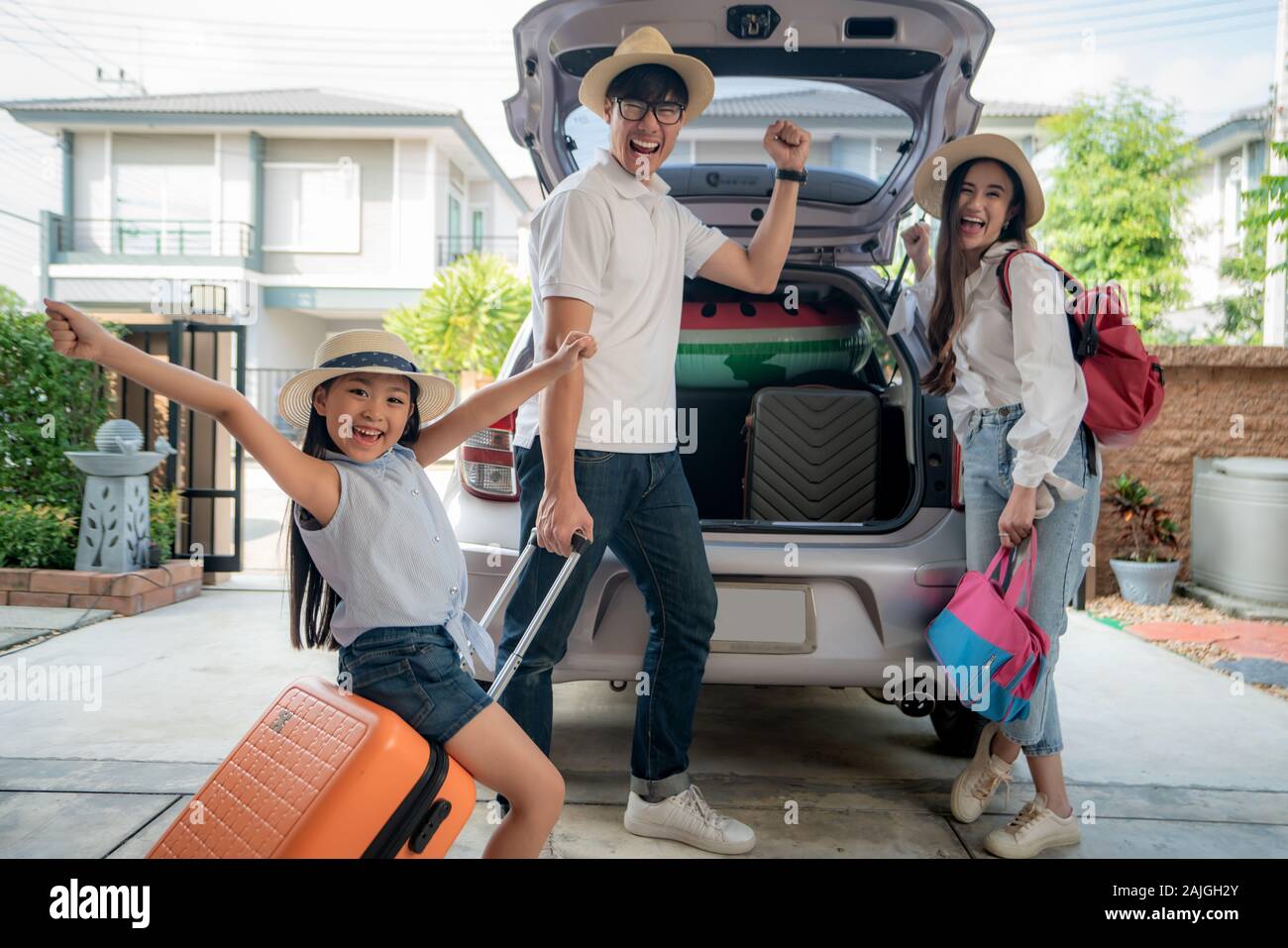 Portrait of Asian family with father, mother and daughter looks happy ...