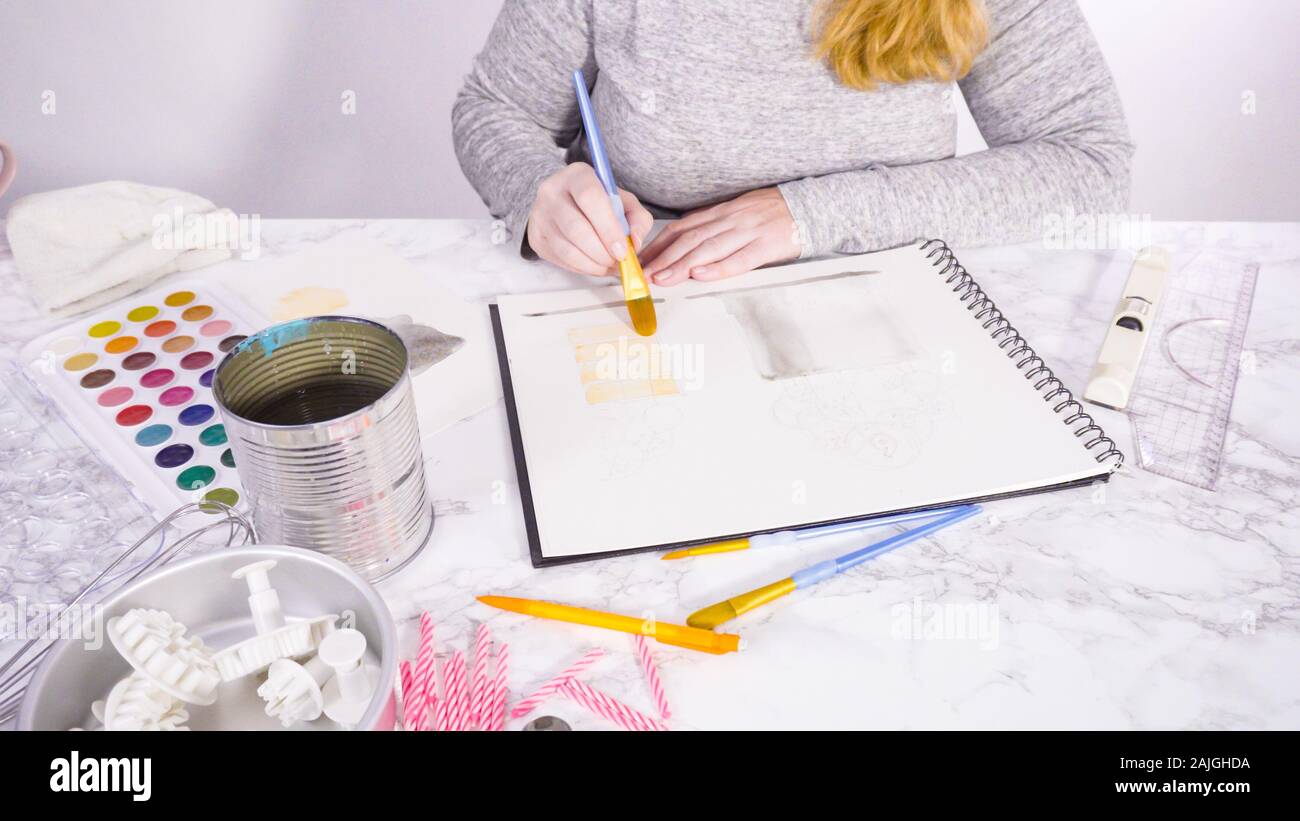 Baker is drawing the design of a birthday cake with watercolors Stock ...