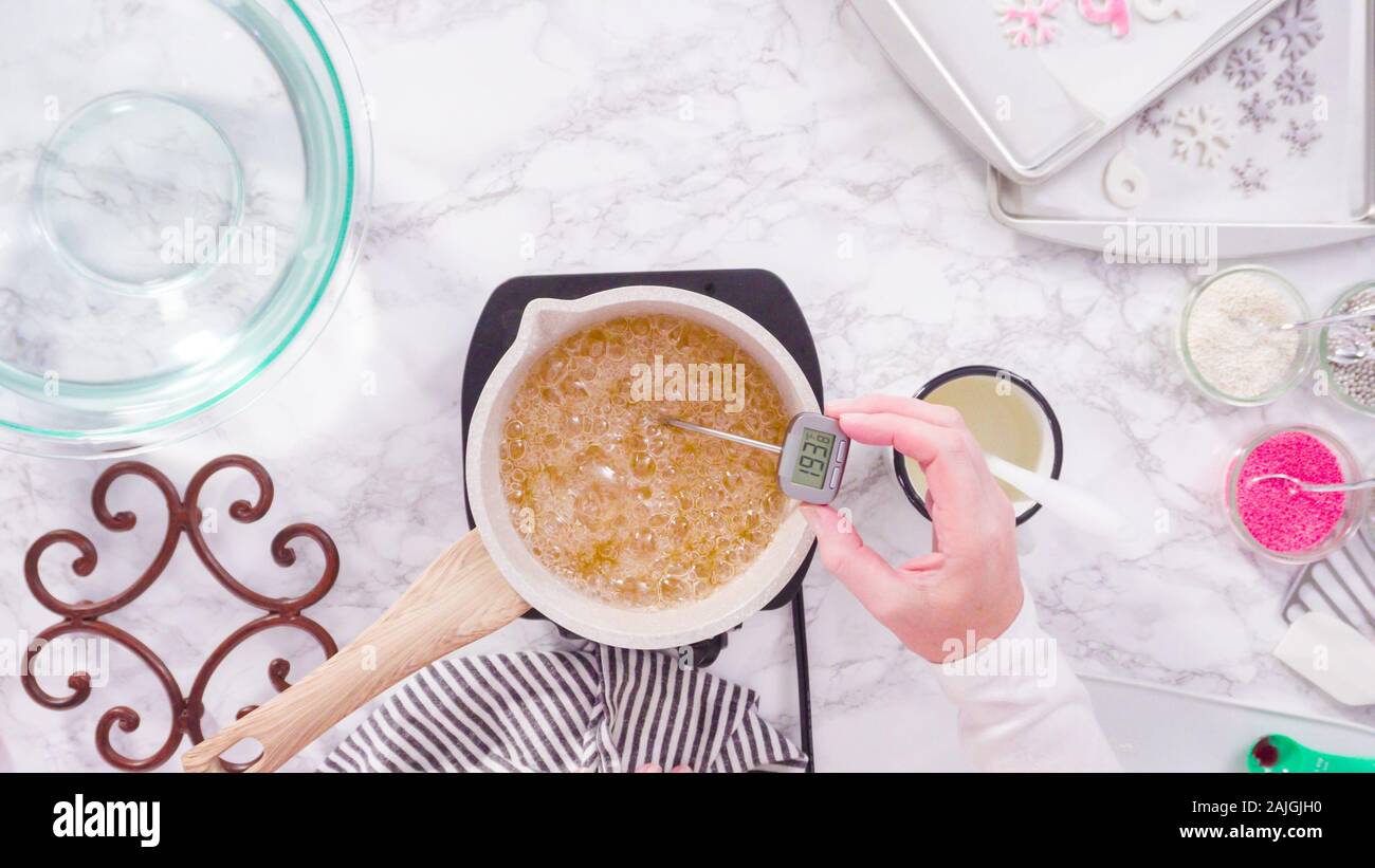 Flat lay. Step by step. Caramelizing sugar in a small cooking pot over ...