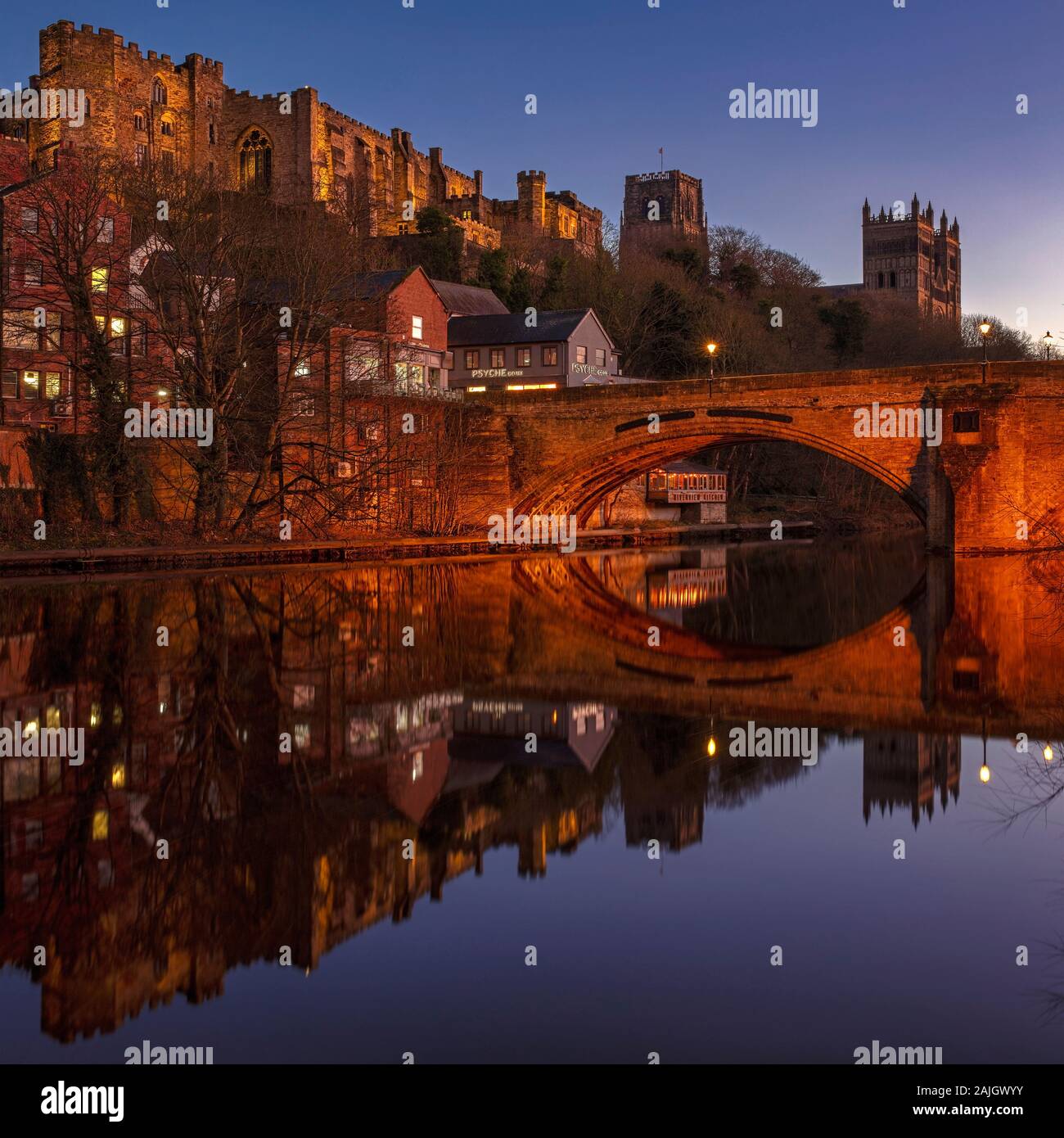 A view at dusk of Durham Castle and Durham Cathedral floodlit and ...