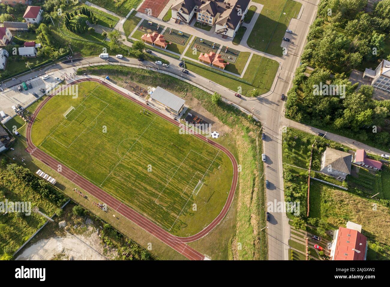 Aerial view of a football field on a stadium covered with green grass ...