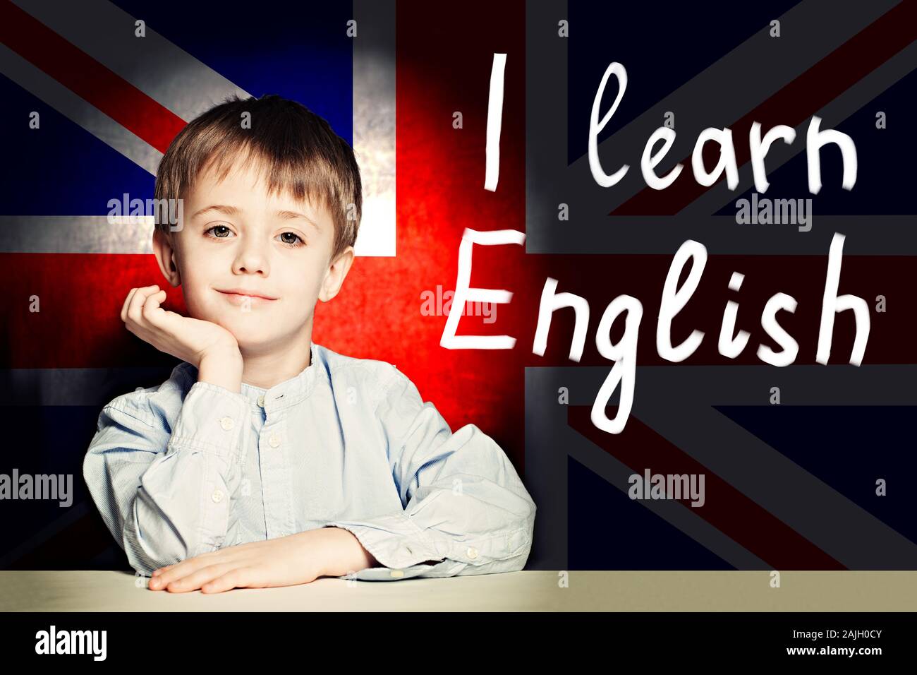 Happy smart child against the UK flag background. Learn English concept ...