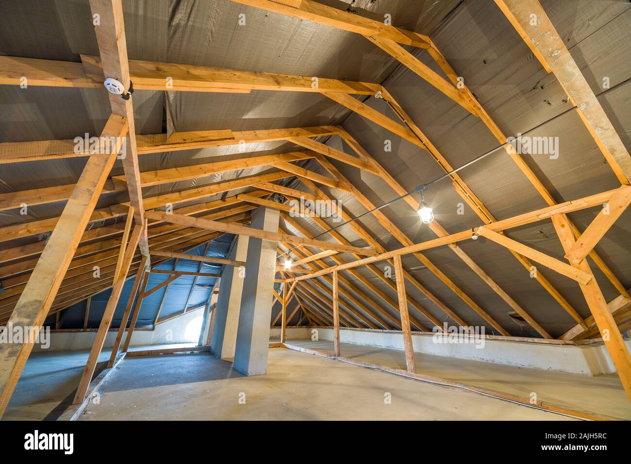 Attic of a building with wooden beams of a roof structure Stock Photo ...