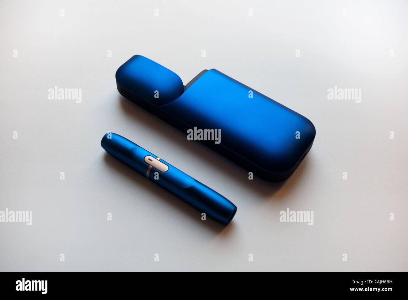 Metallic blue tobacco heating device with electronic cigarette isolated ...
