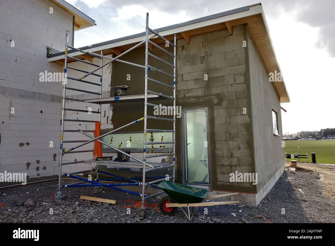 Facade of white block building under construction works Stock Photo - Alamy
