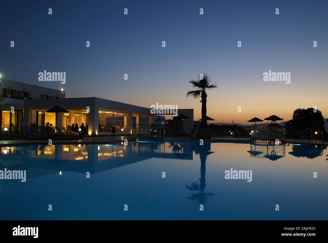 Swimming pool of luxury hotel at dusk Stock Photo - Alamy