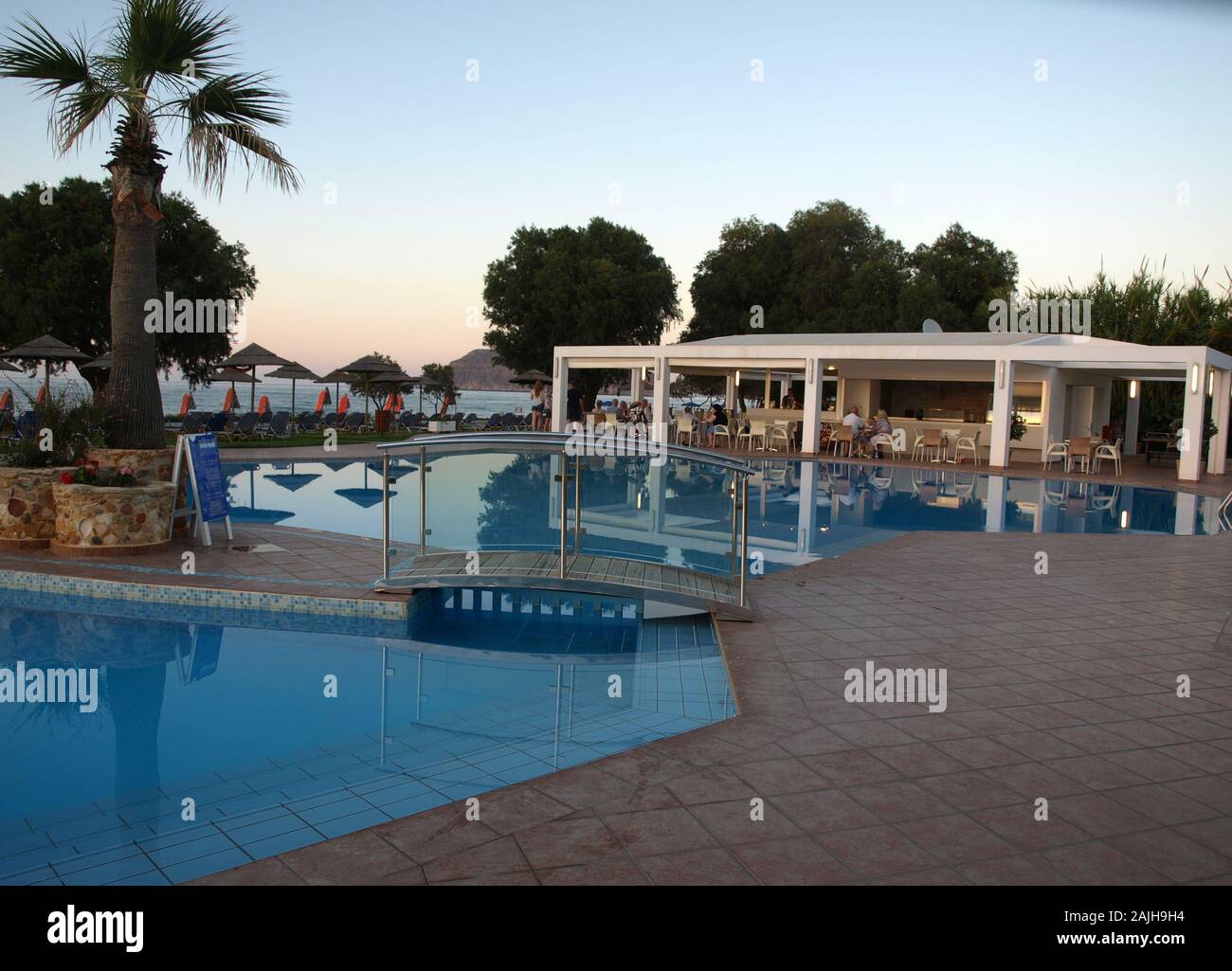 Swimming pool of luxury hotel at dusk Stock Photo - Alamy