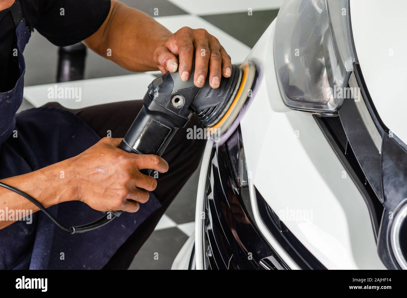 Man hands holding the work tool polish the car.Buffing and polishing ...