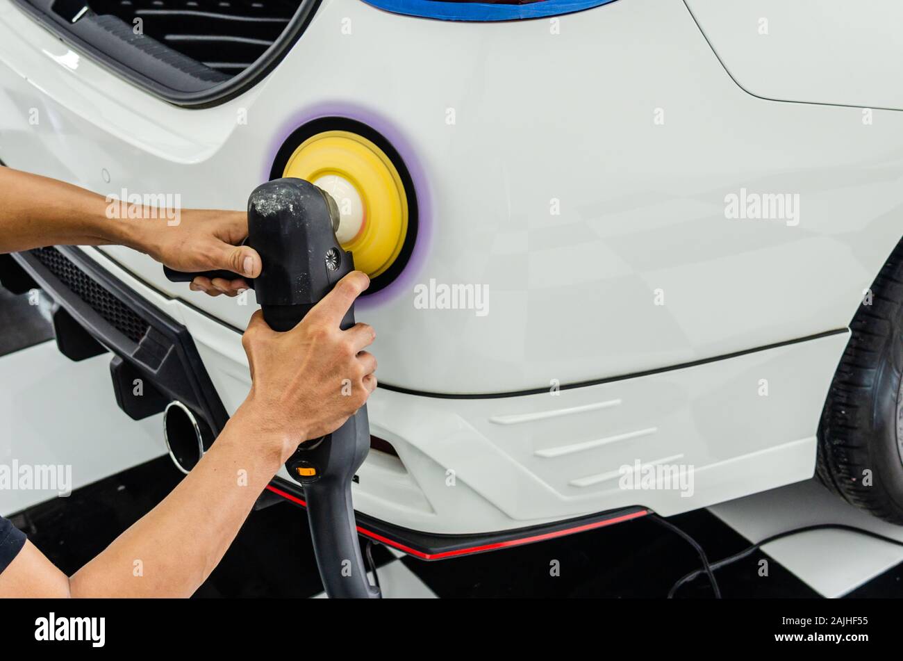 Man hands holding the work tool polish the car.Buffing and polishing ...