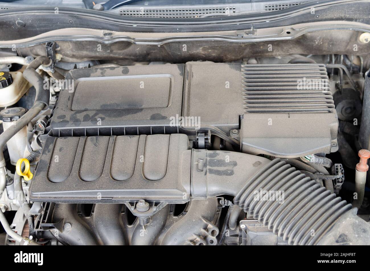 The dust on the engine compartment is dirty Stock Photo - Alamy