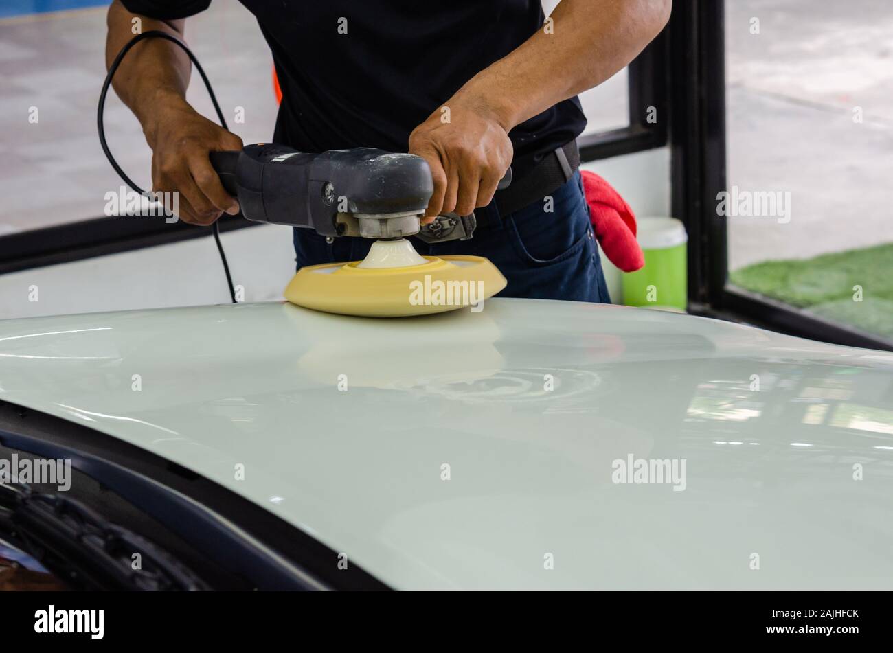 Man hands holding the work tool polish the car.Buffing and polishing ...