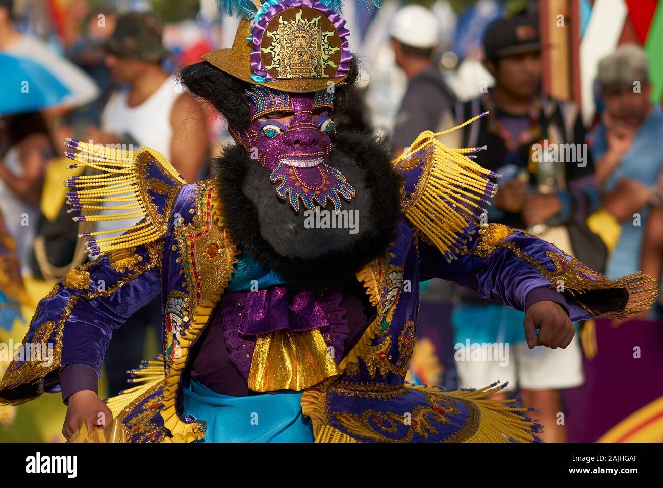 Female members of a Morenada dance group in ornate costumes performing ...