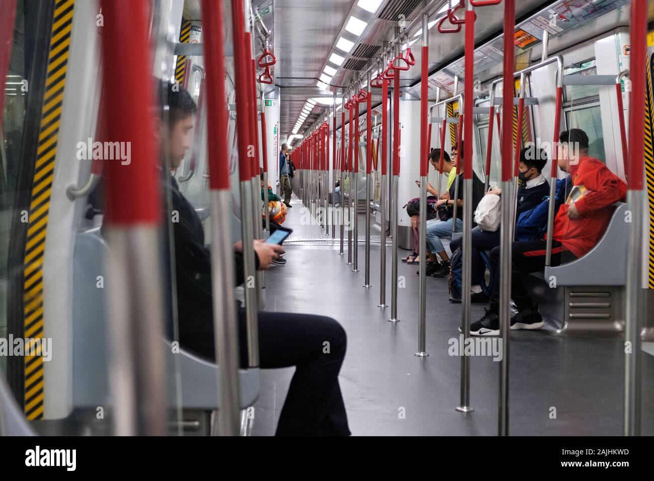 Asian people sitting in subway hi-res stock photography and images - Alamy