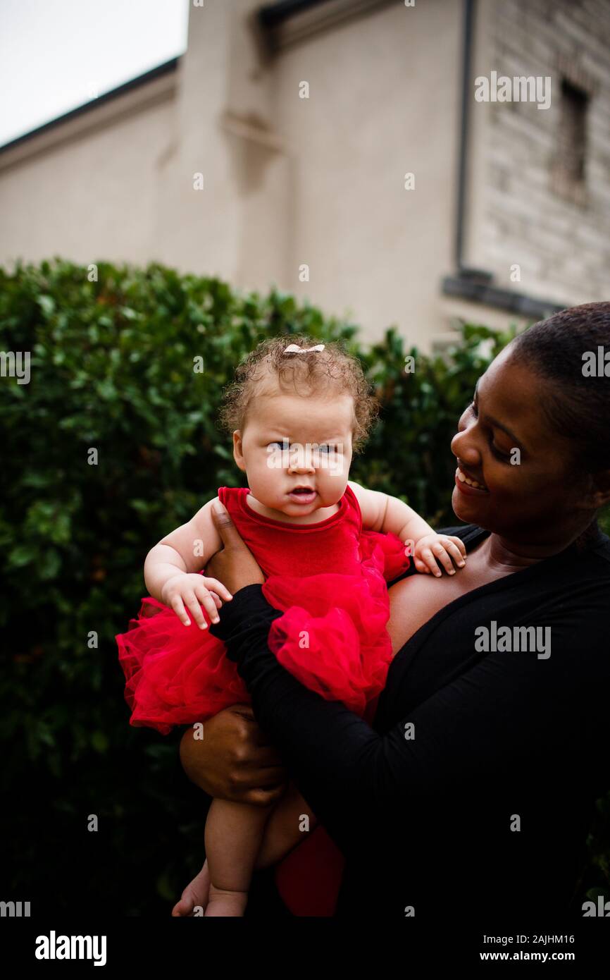 African American Step Sister Holding Biracial Baby Sister Stock Photo ...