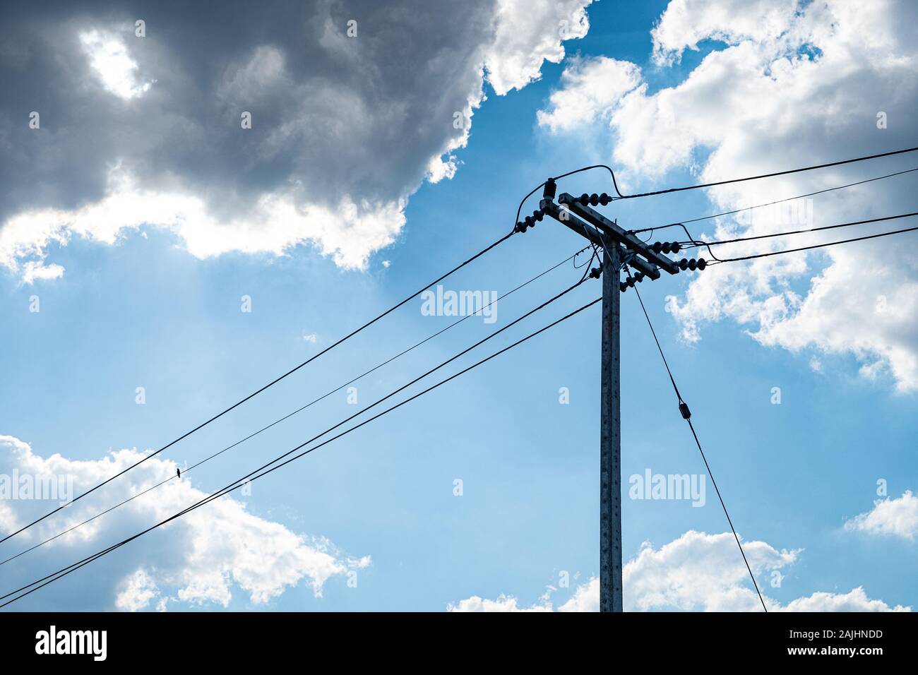 Electricity concrete post and high voltage wire at blue sky background ...