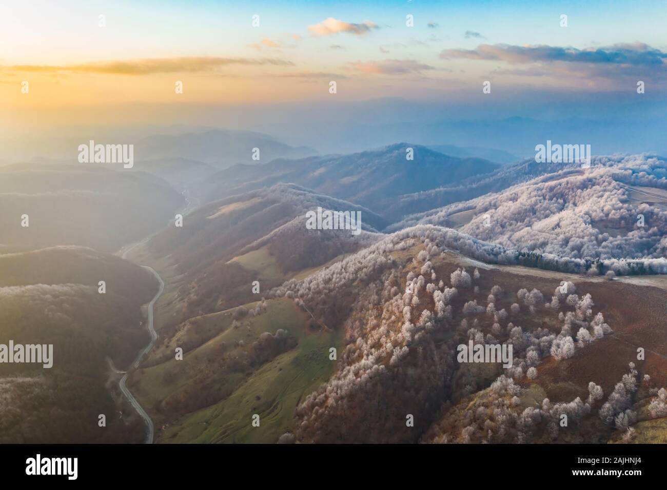 Aerial view of idyllic winter landscape with frozen trees in ...