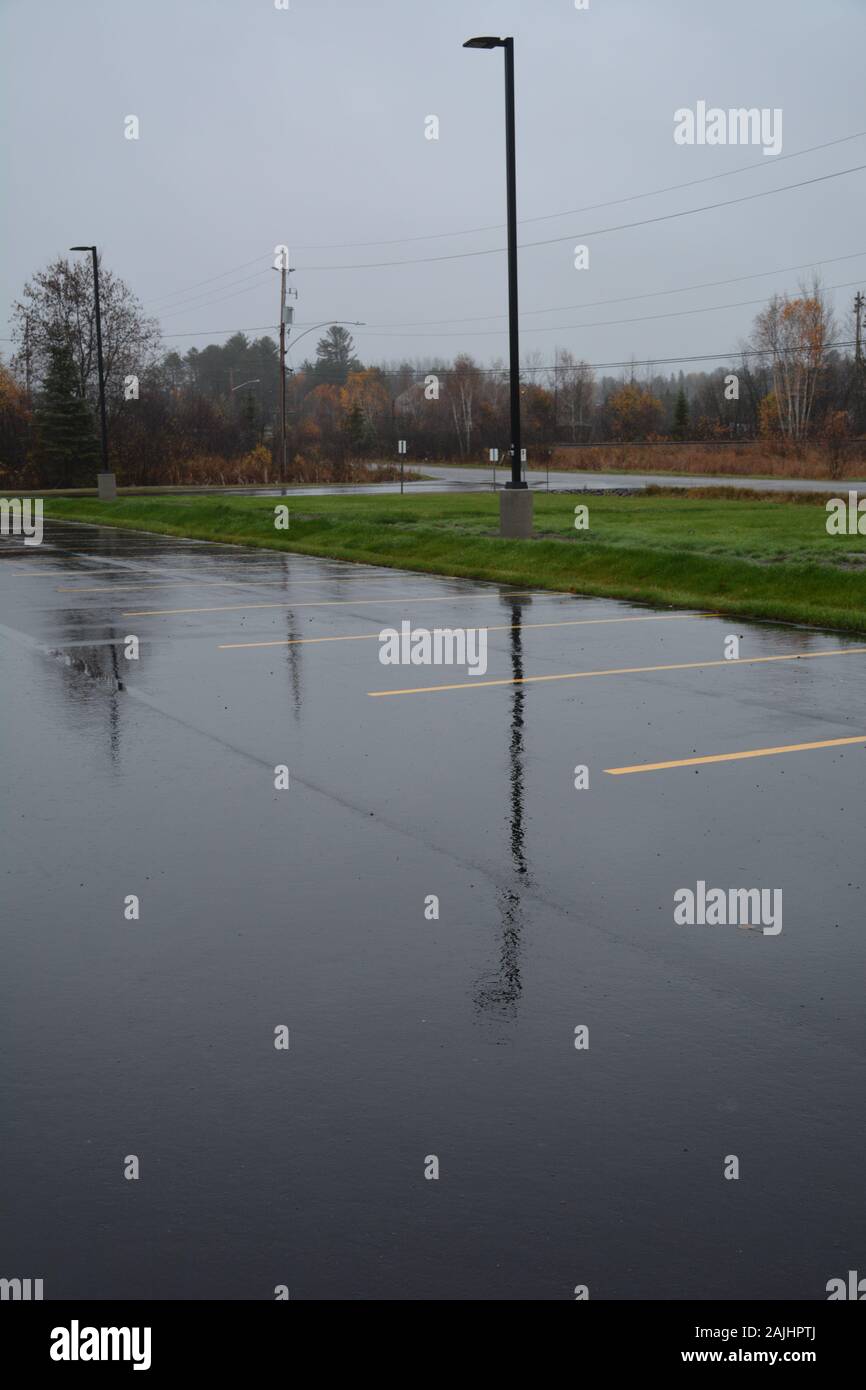 Rain in wet school parking lot Stock Photo - Alamy