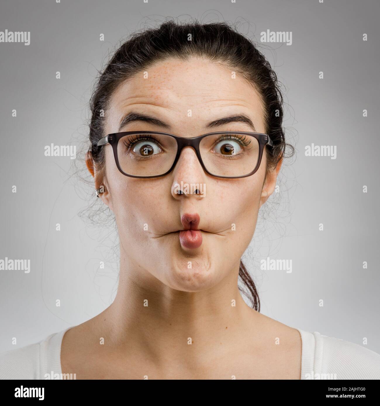 Cute portrait of a woman making a silly face Stock Photo - Alamy