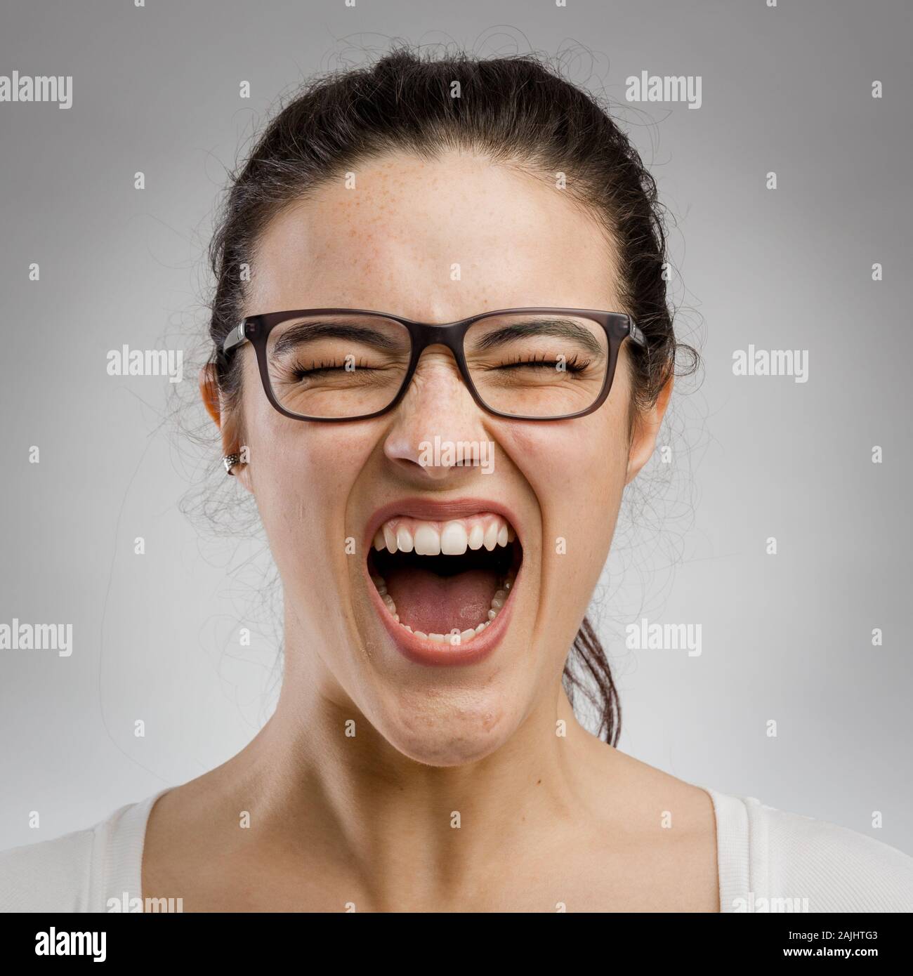 Cute portrait of a woman yelling Stock Photo - Alamy
