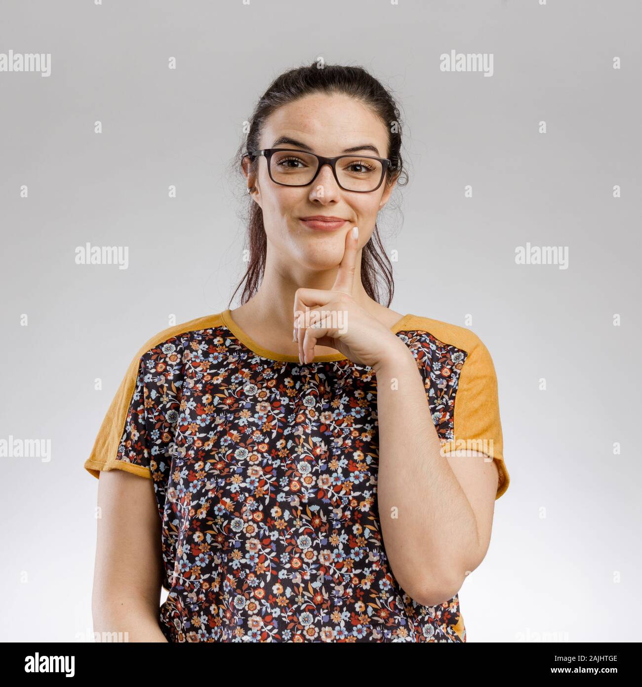 Funny portrait of woman thinking on something Stock Photo - Alamy