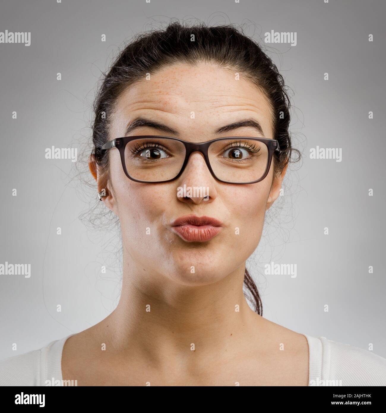 Cute portrait of a woman making a silly face Stock Photo - Alamy