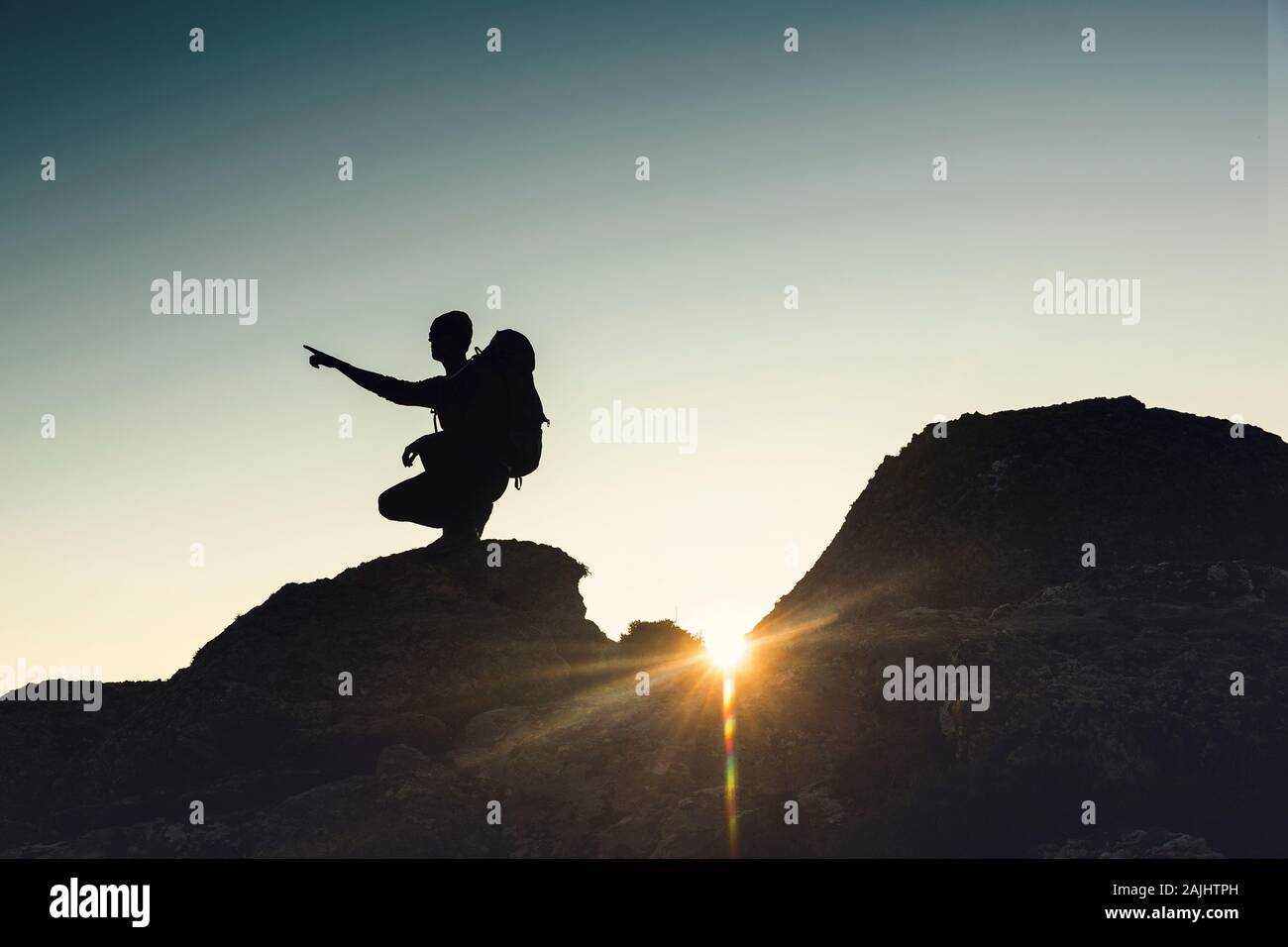 Man mountain pointing hi-res stock photography and images - Alamy