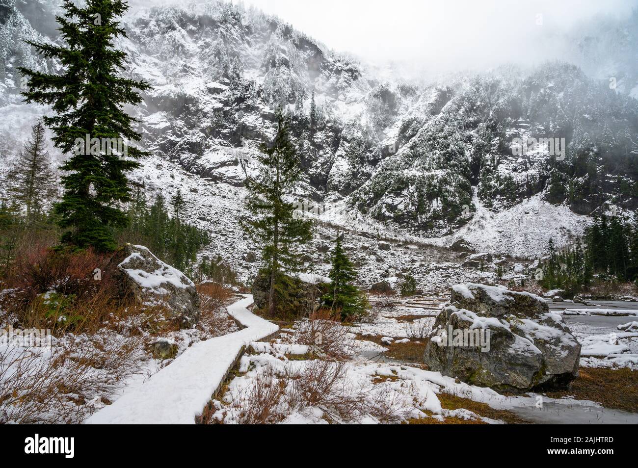 Snow Covered Path In An Alpine Cirque Stock Photo - Alamy