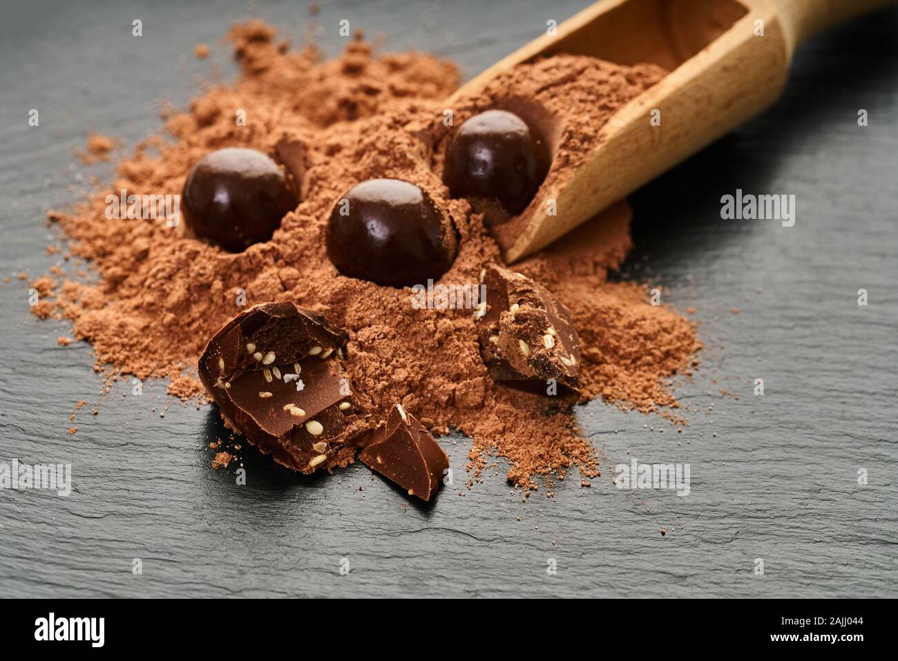 round chocolate candies close-up on a black background Stock Photo - Alamy