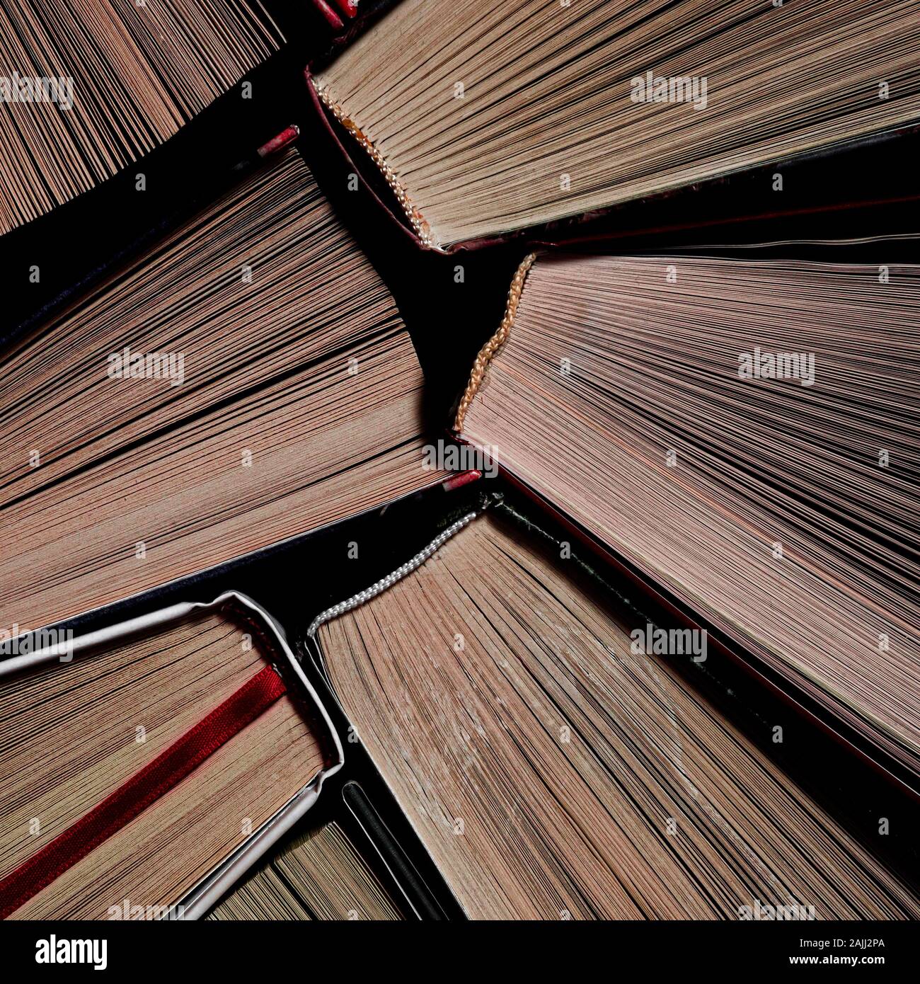 Lots of colourful open books stand on the shelf. Ready to read Stock ...