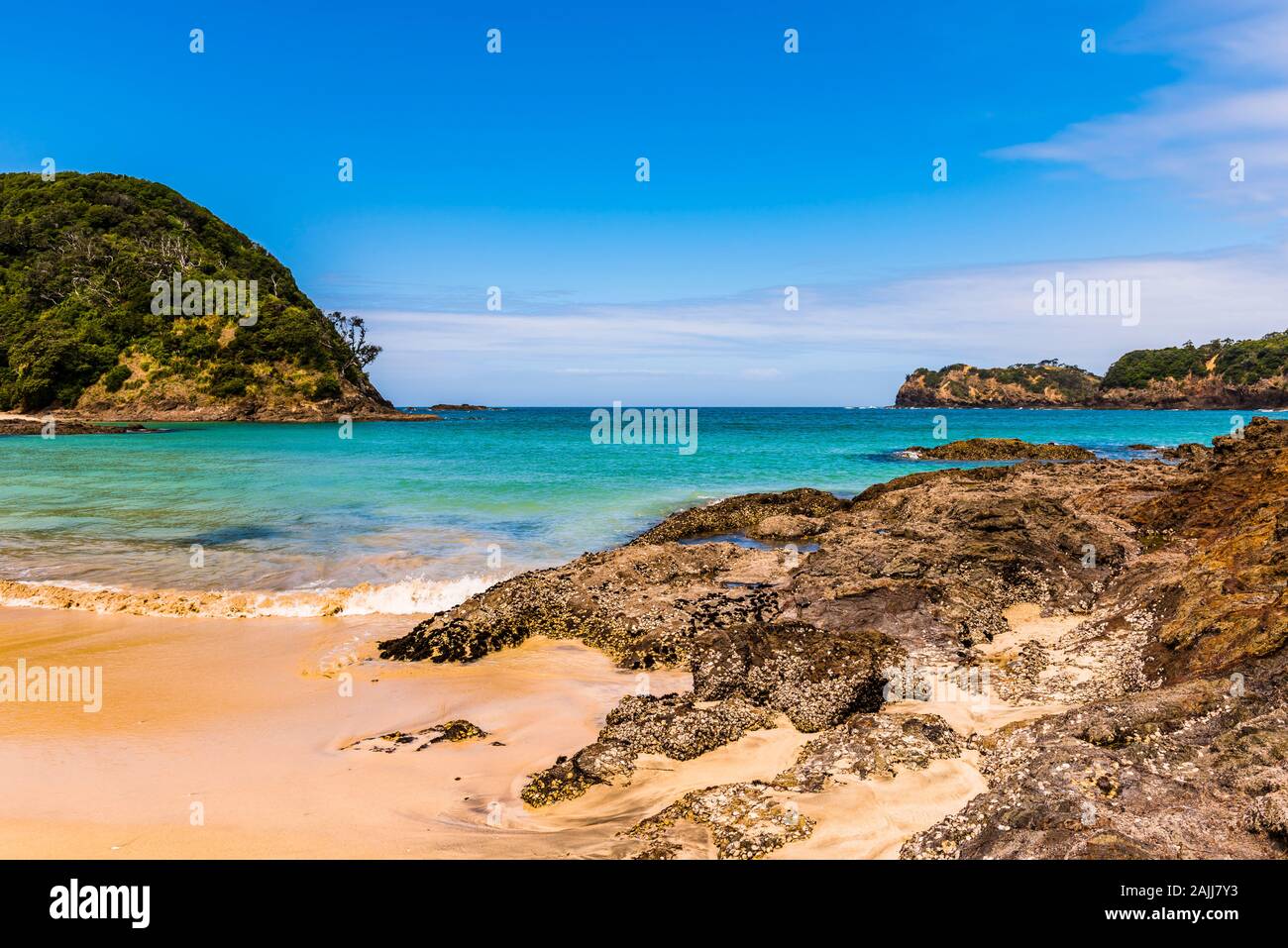 Sand and rocks at Matapouri Beach, Northland, New Zealand Stock Photo ...