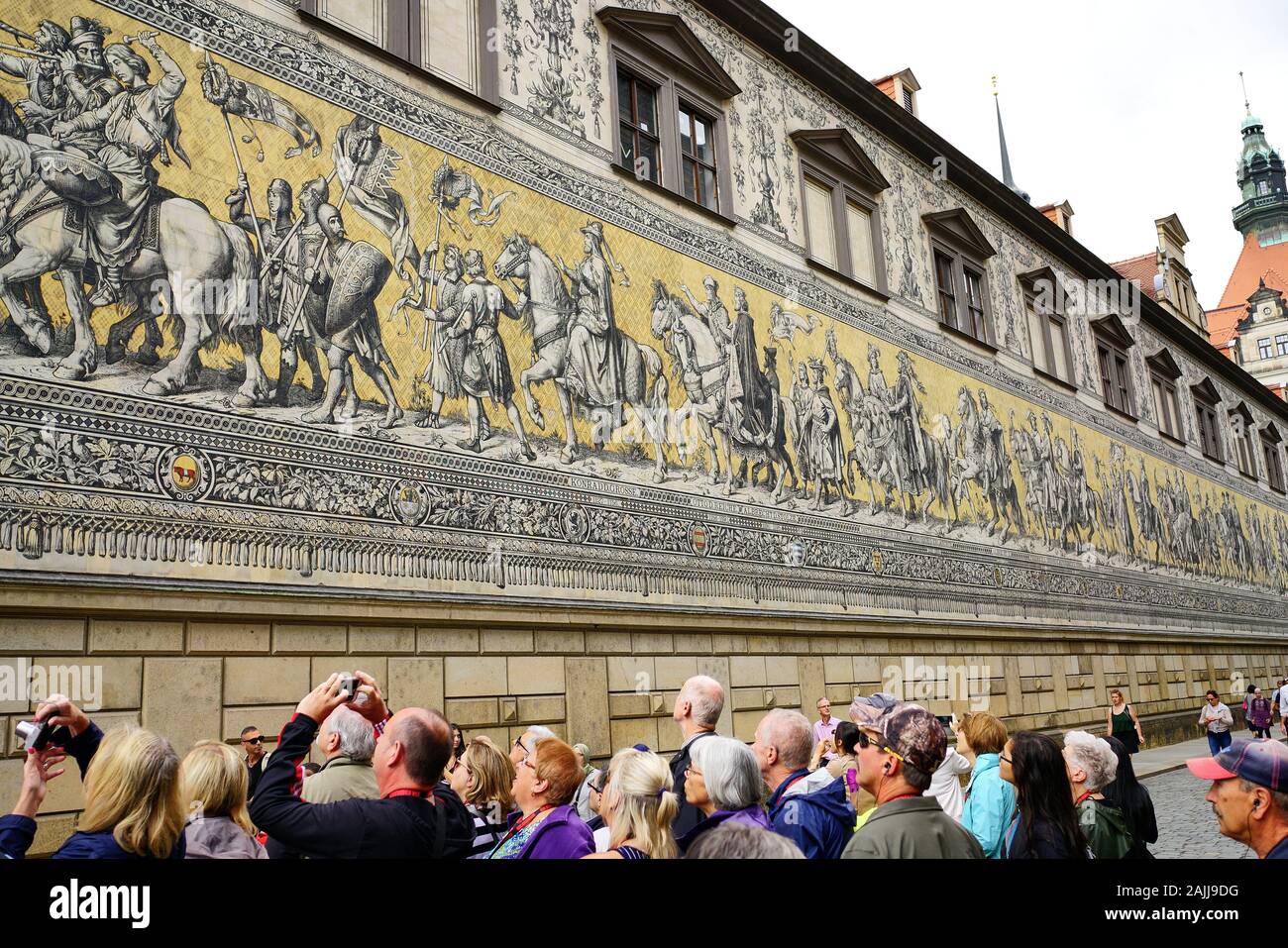 Tourists admire and photograph the 335 foot long outdoor mosaic called ...