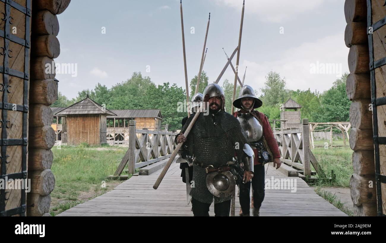 A group of medieval knights come back from the battle. Military ...