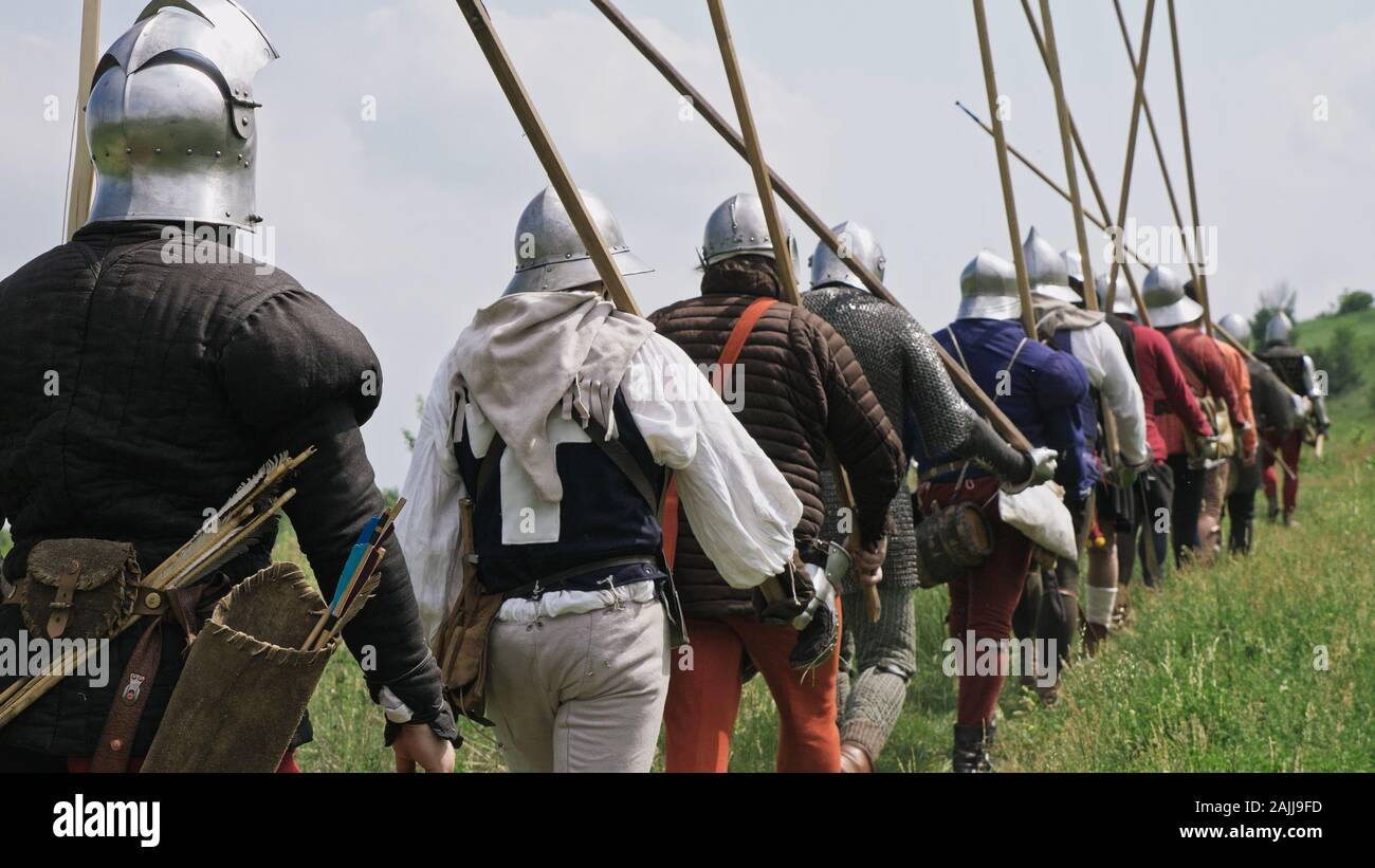 Back view of group medieval knights going on the battle Stock Photo - Alamy