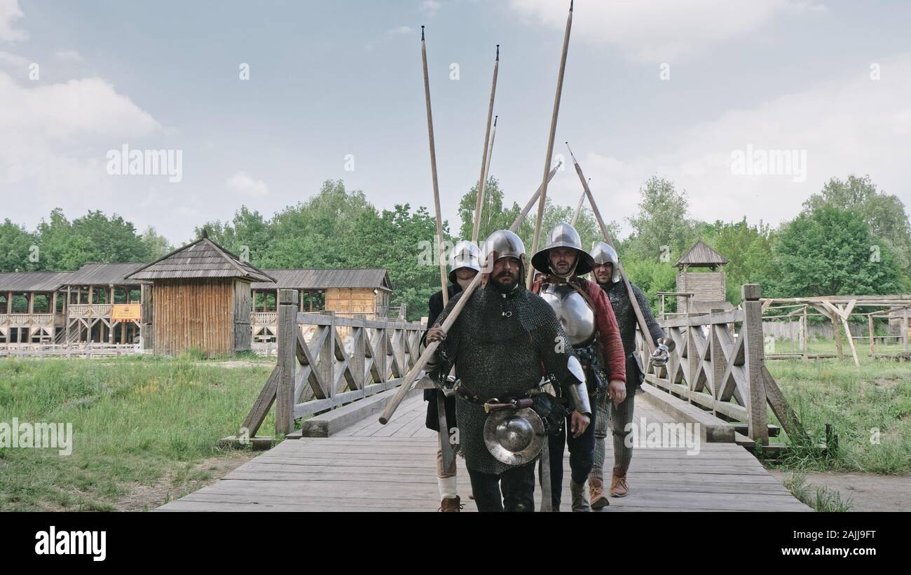 A group of medieval knights come back from the battle. Military ...