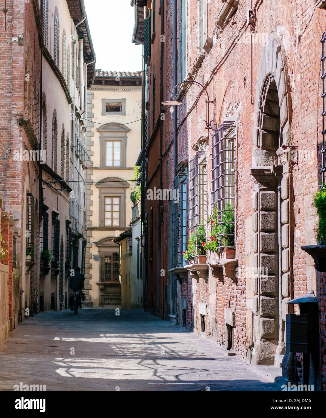 Street of the old town of Italy, with beautiful window sills with ...