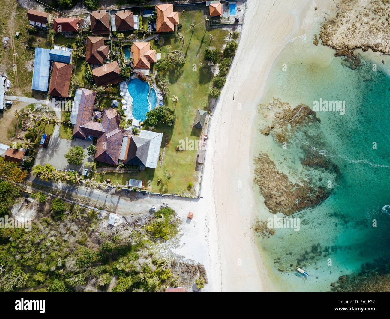 Aerial view of tropical resort at ocean coastline Stock Photo - Alamy
