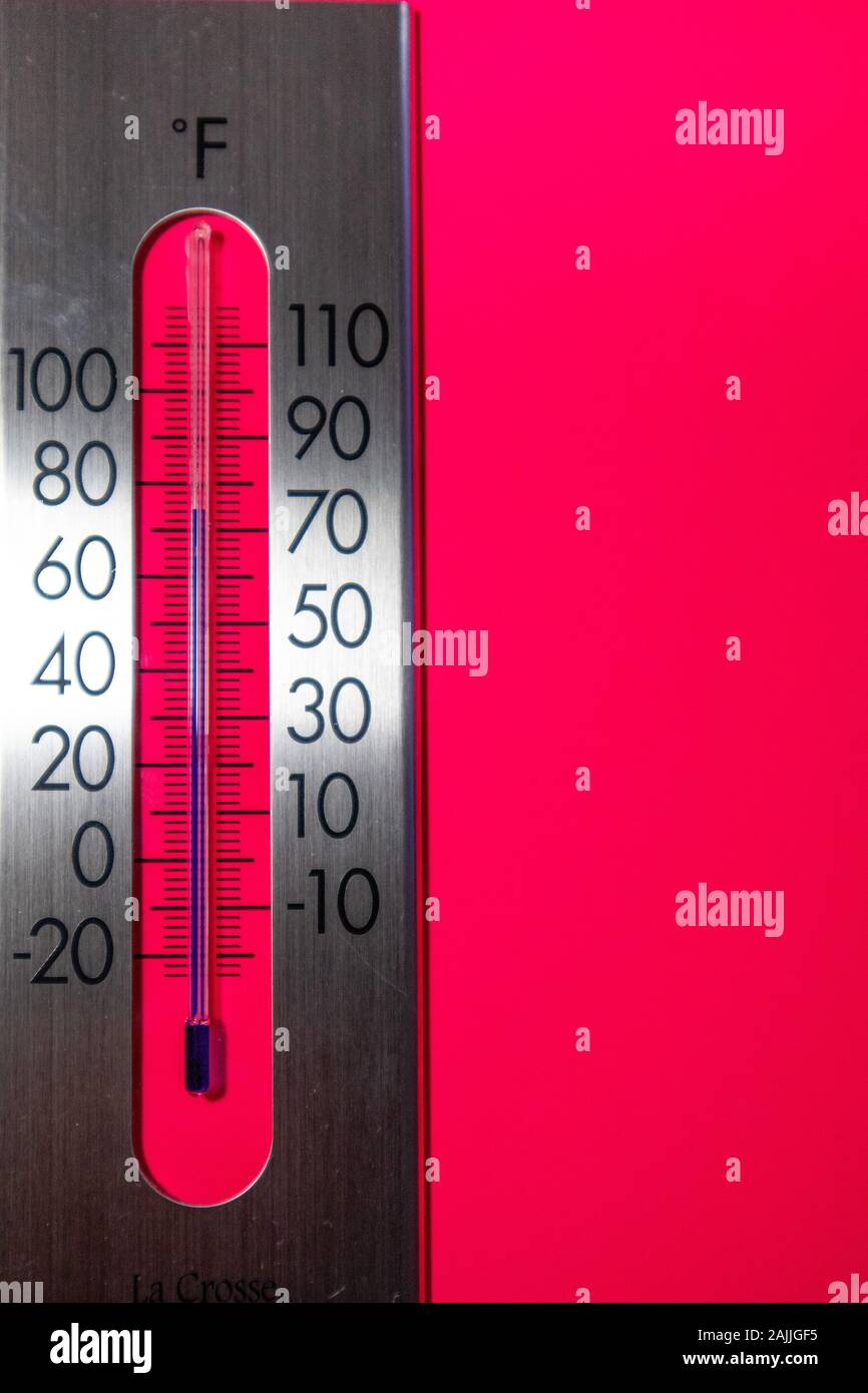 Silver thermometer with red background for copy space Stock Photo - Alamy