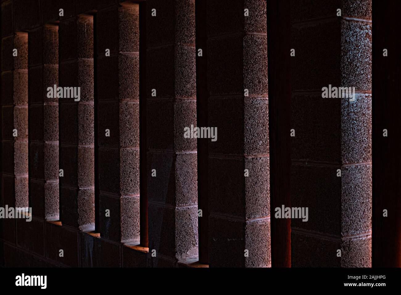 light rays through the brick old window on the wall Stock Photo - Alamy