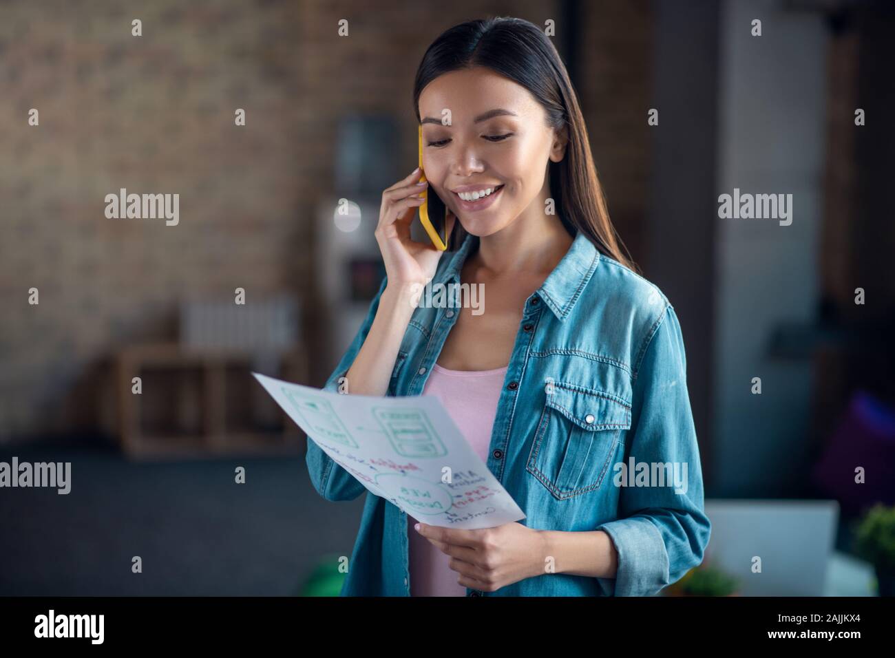 Nice positive woman having a call for work Stock Photo - Alamy