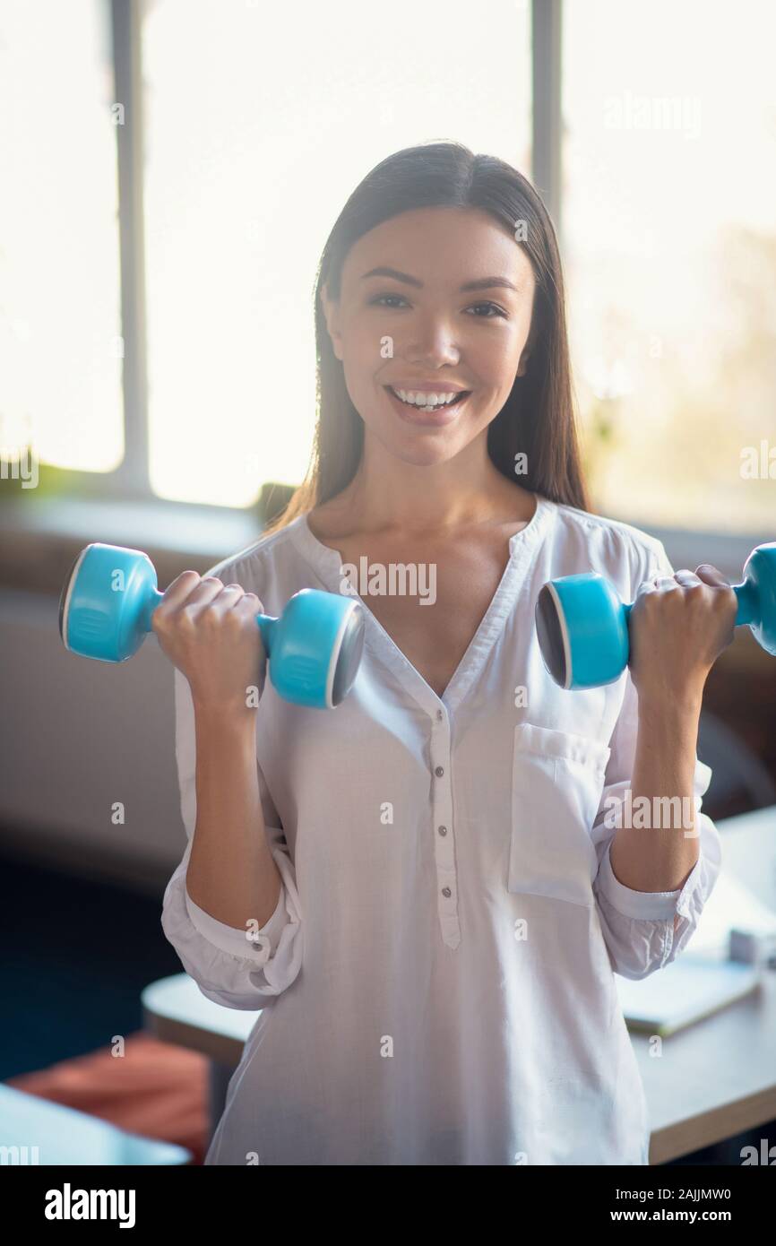 Positive joyful Asian woman smiling to you Stock Photo - Alamy
