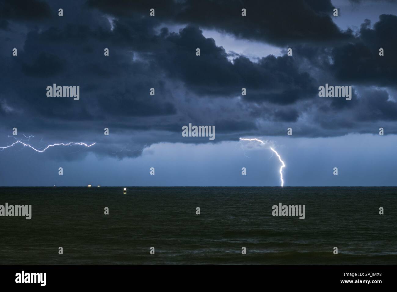 Lightning strike and dramatic clouds over the North Sea Stock Photo - Alamy