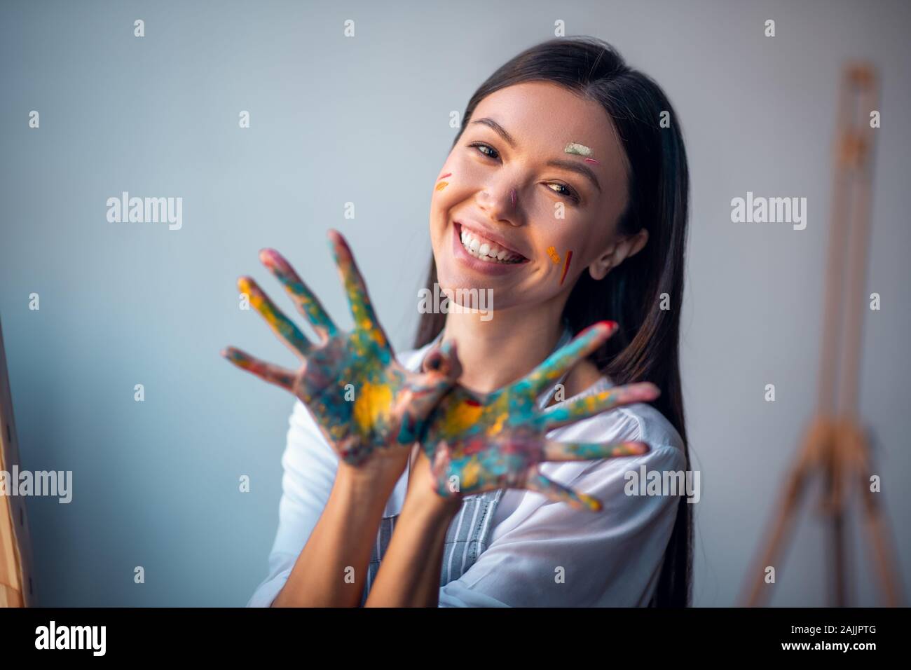 Young beautiful showing paint hi-res stock photography and images - Alamy