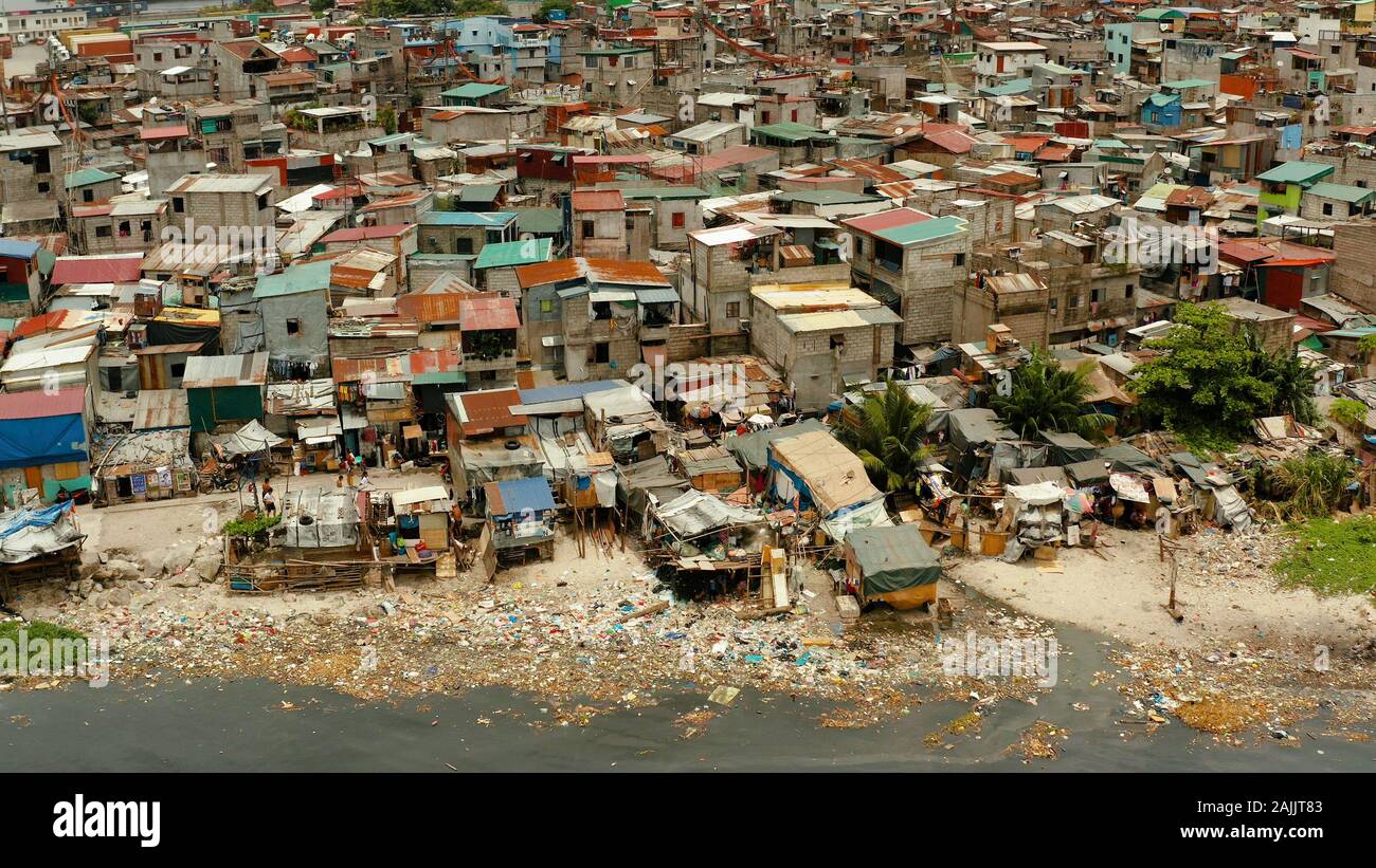 Slums in Manila near the port. River polluted with plastic and garbage. Manila, Philippines ...