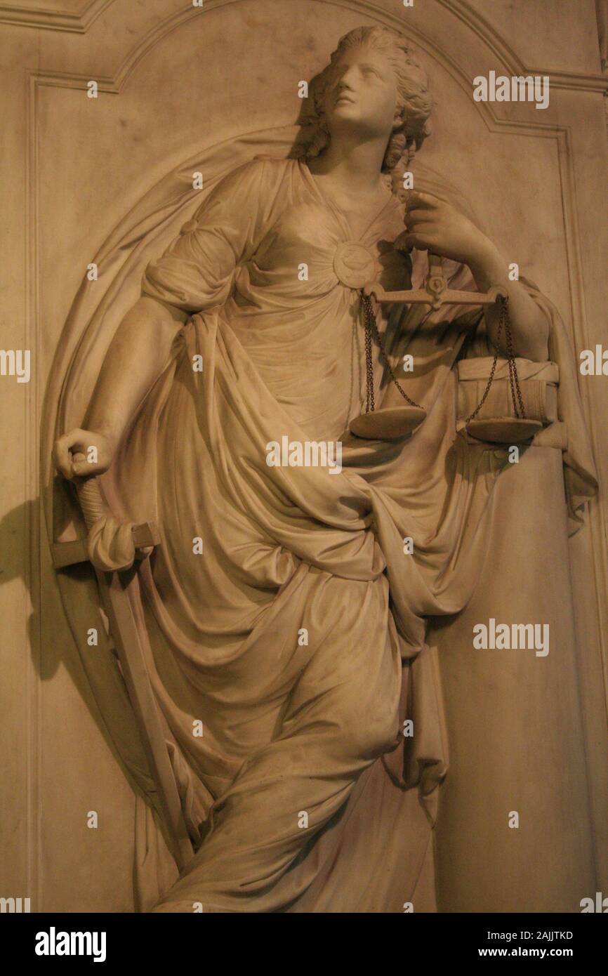 Stone wall carving of the Lady of Justice Stock Photo - Alamy