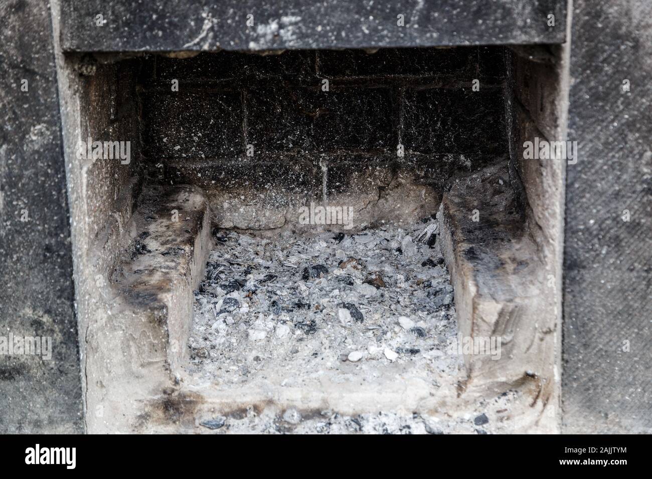 ash and coals in a street stone grill Stock Photo - Alamy