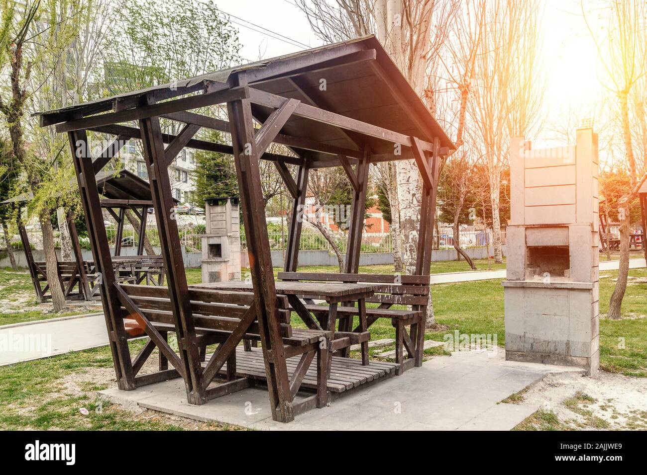 summer gazebo for rest and picnic next to the barbecue in one of the ...