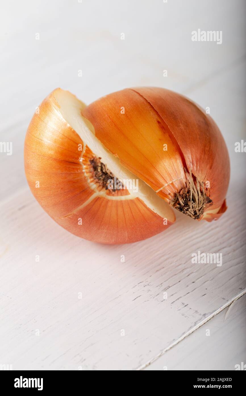Onion, cut in half, isolated on white background Stock Photo - Alamy