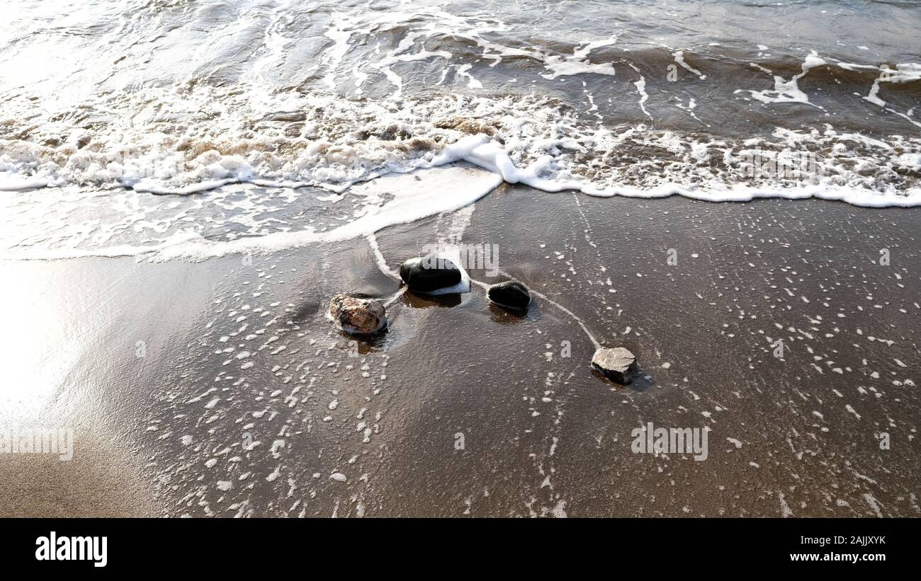 Stones at the beach. Nature background Stock Photo - Alamy