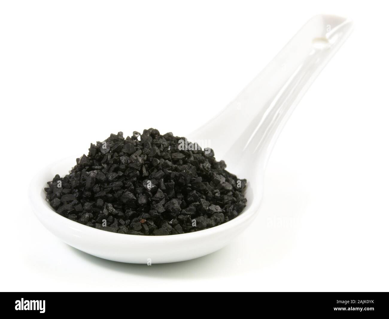 Black Stone Salt on white Background Stock Photo - Alamy