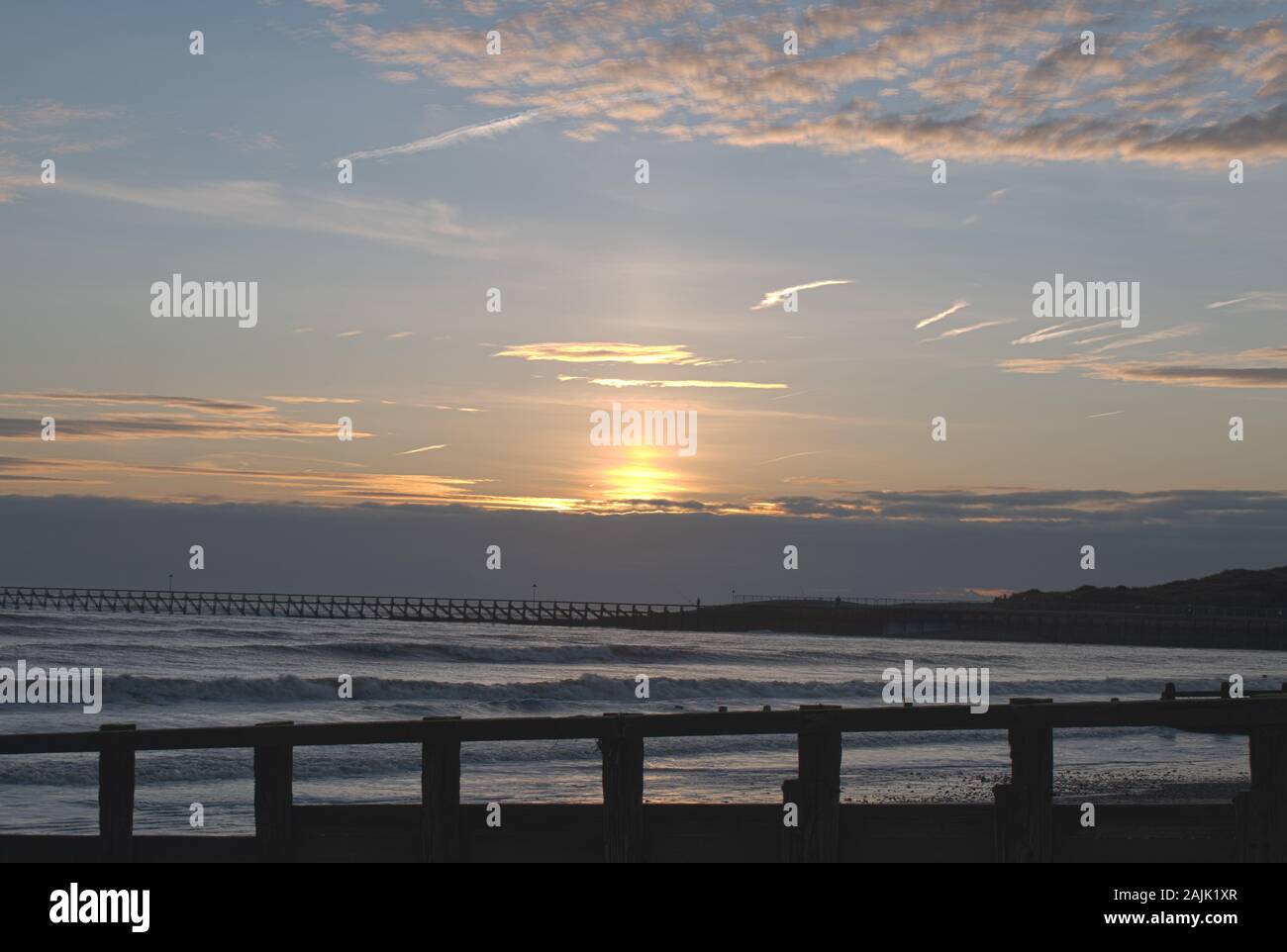 Sunset on Littlehampton seafront as the sun dips behind cloud on the ...